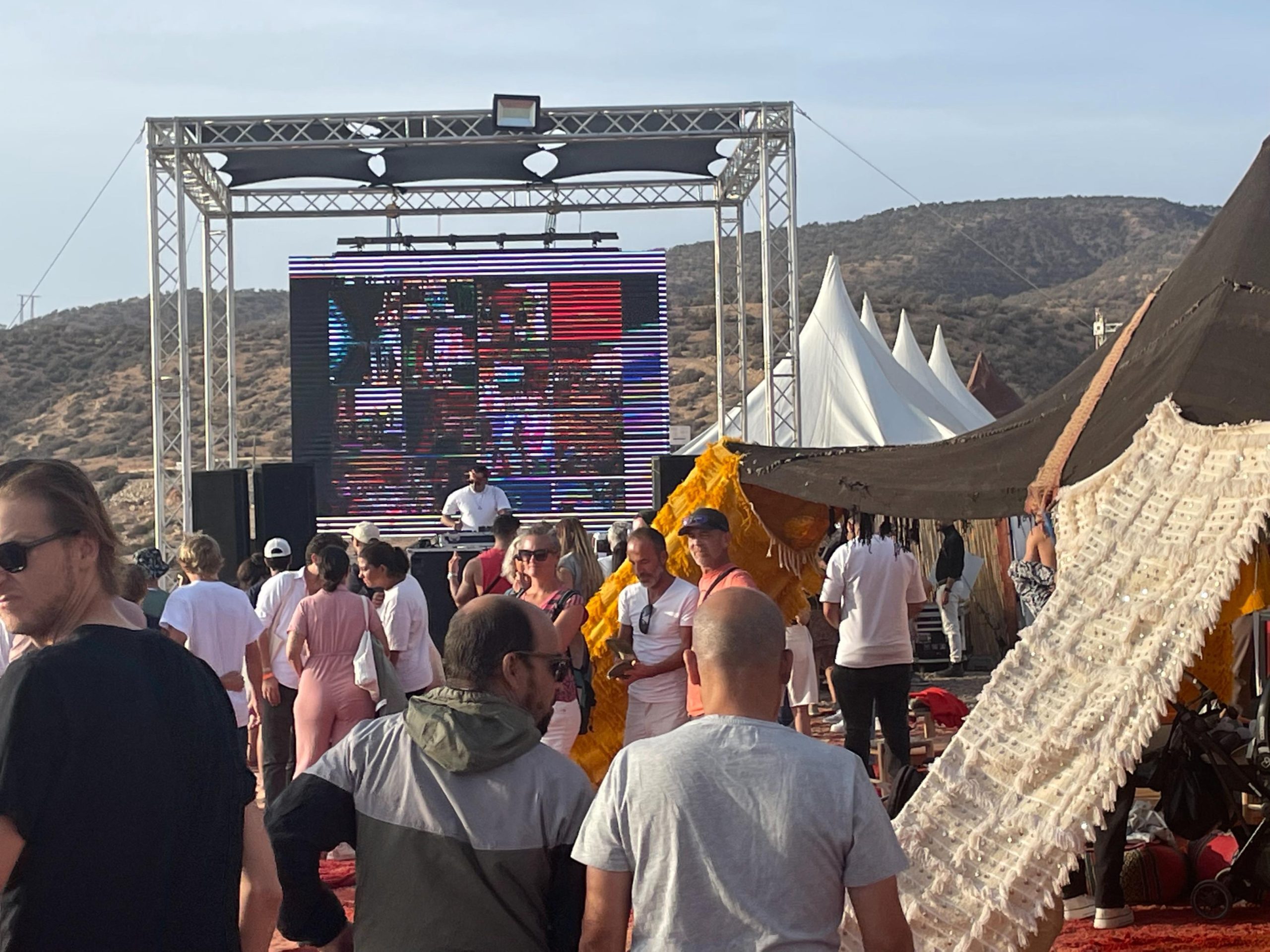 Dj spinning decks inside the festival - Boardsport SOURCE